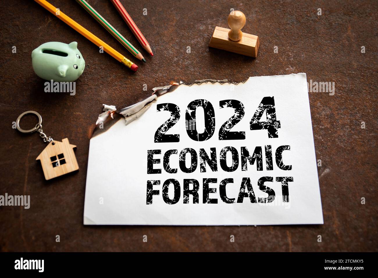 2024 Economic Forecast Concept. Sheet of paper with text on a rusty ...