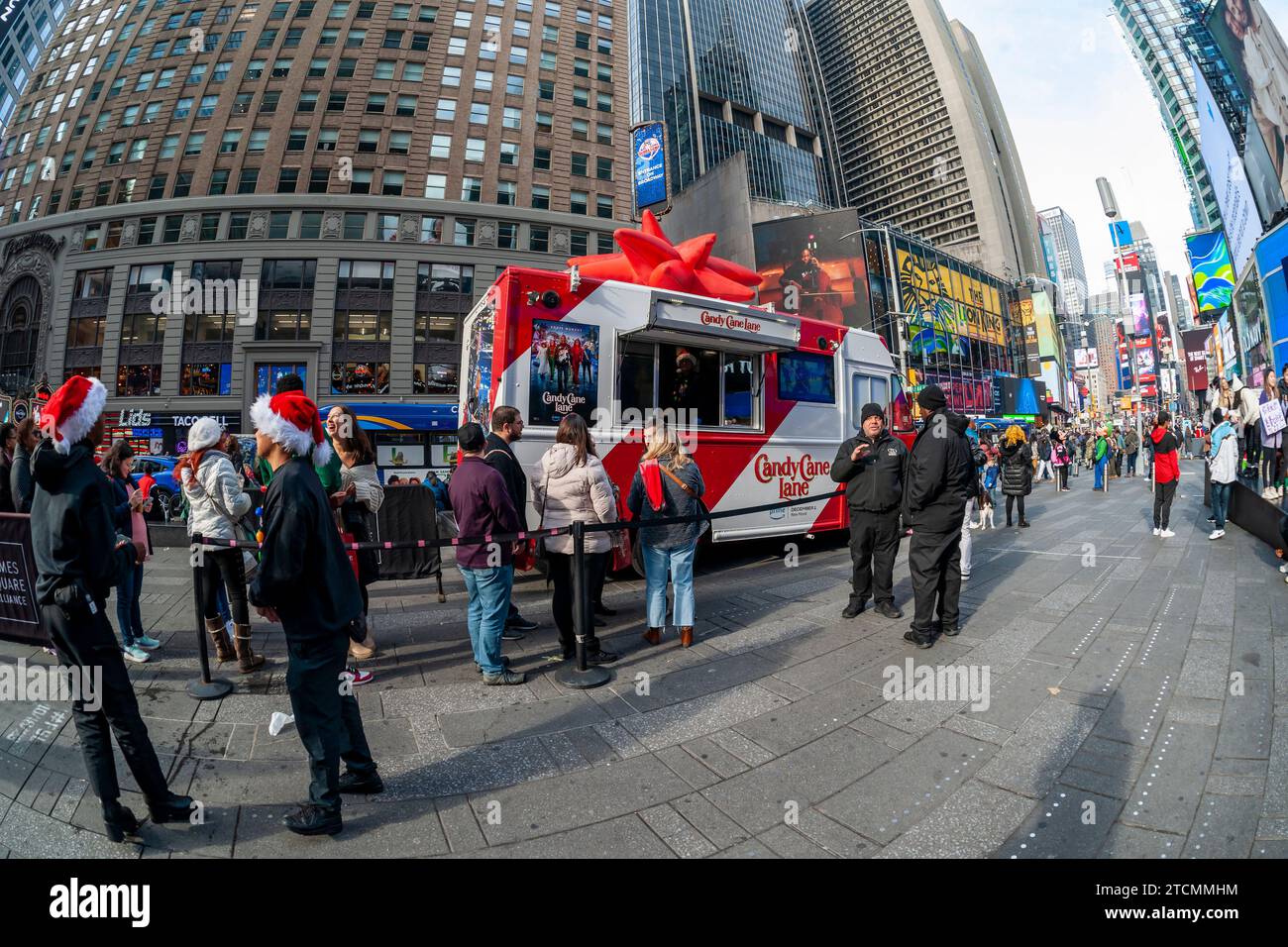 People wait on line for free hot chocolate at a brand activation of ...