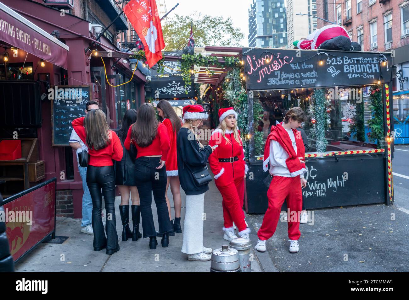 Hundreds of Santas, accompanied by their helpers and some naughty elves ...
