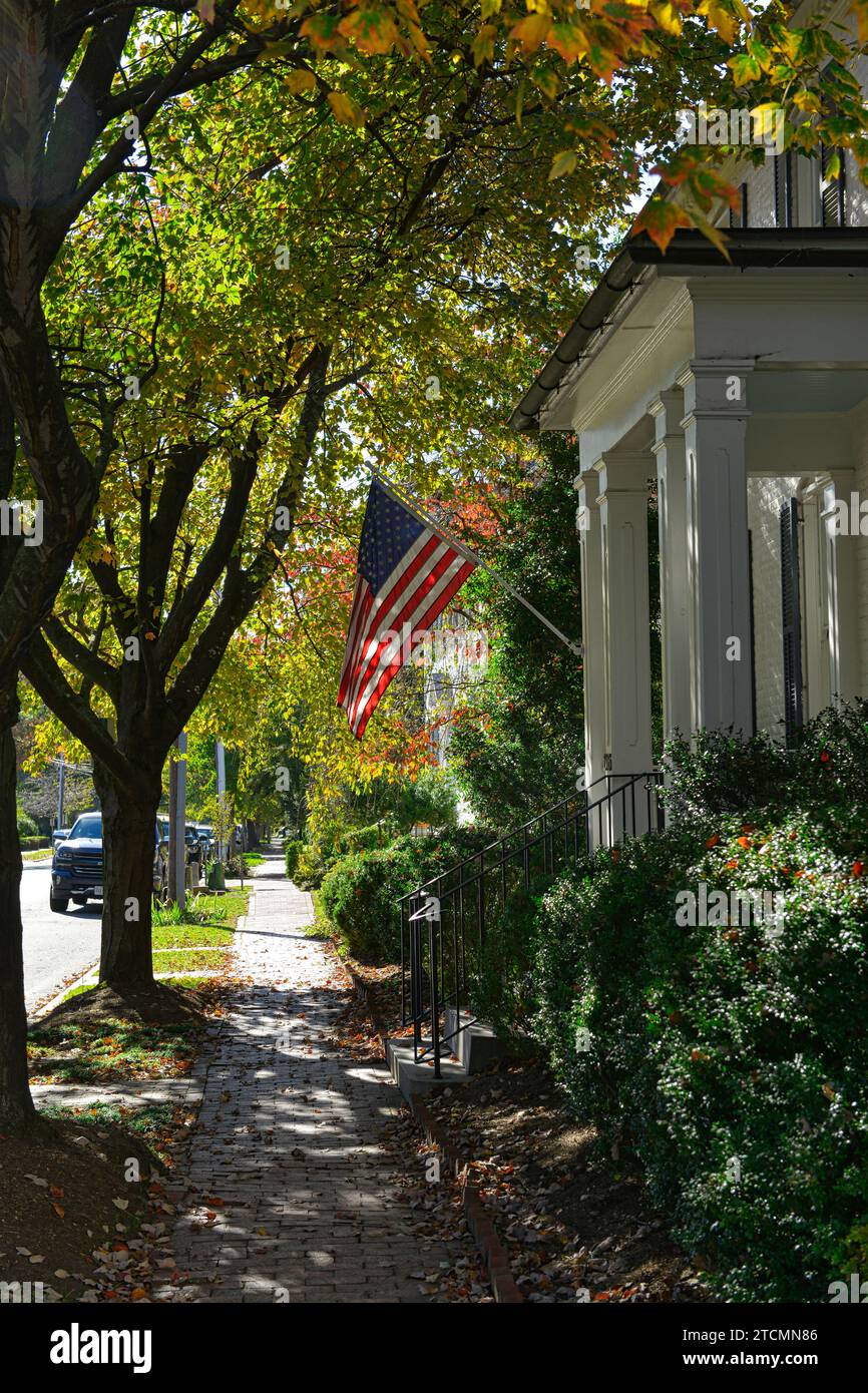 American flag flying outside a beautiful colonial style house on Caroline Street in the historic ...