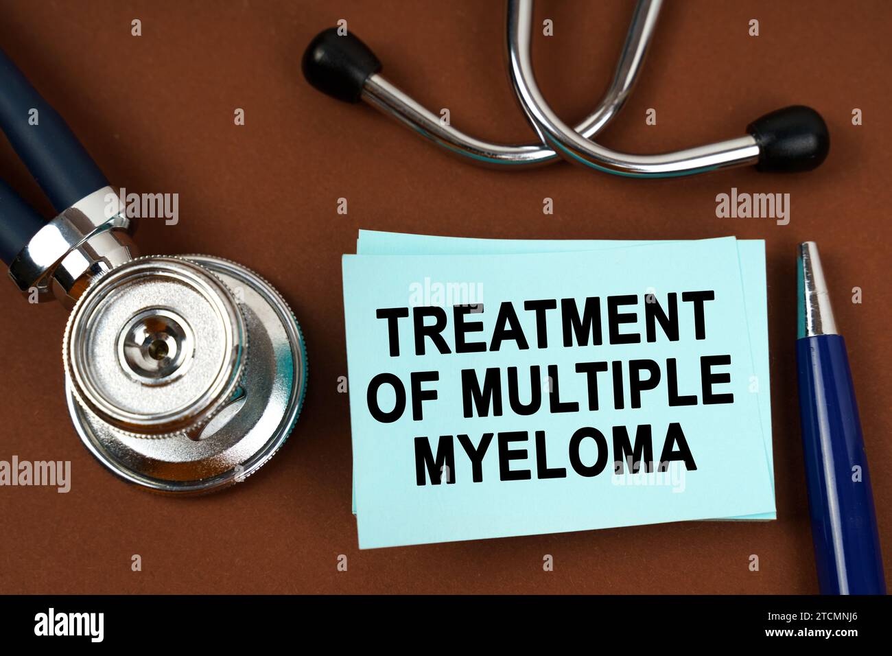 Medical concept. On a brown surface there is a stethoscope, a pen and ...