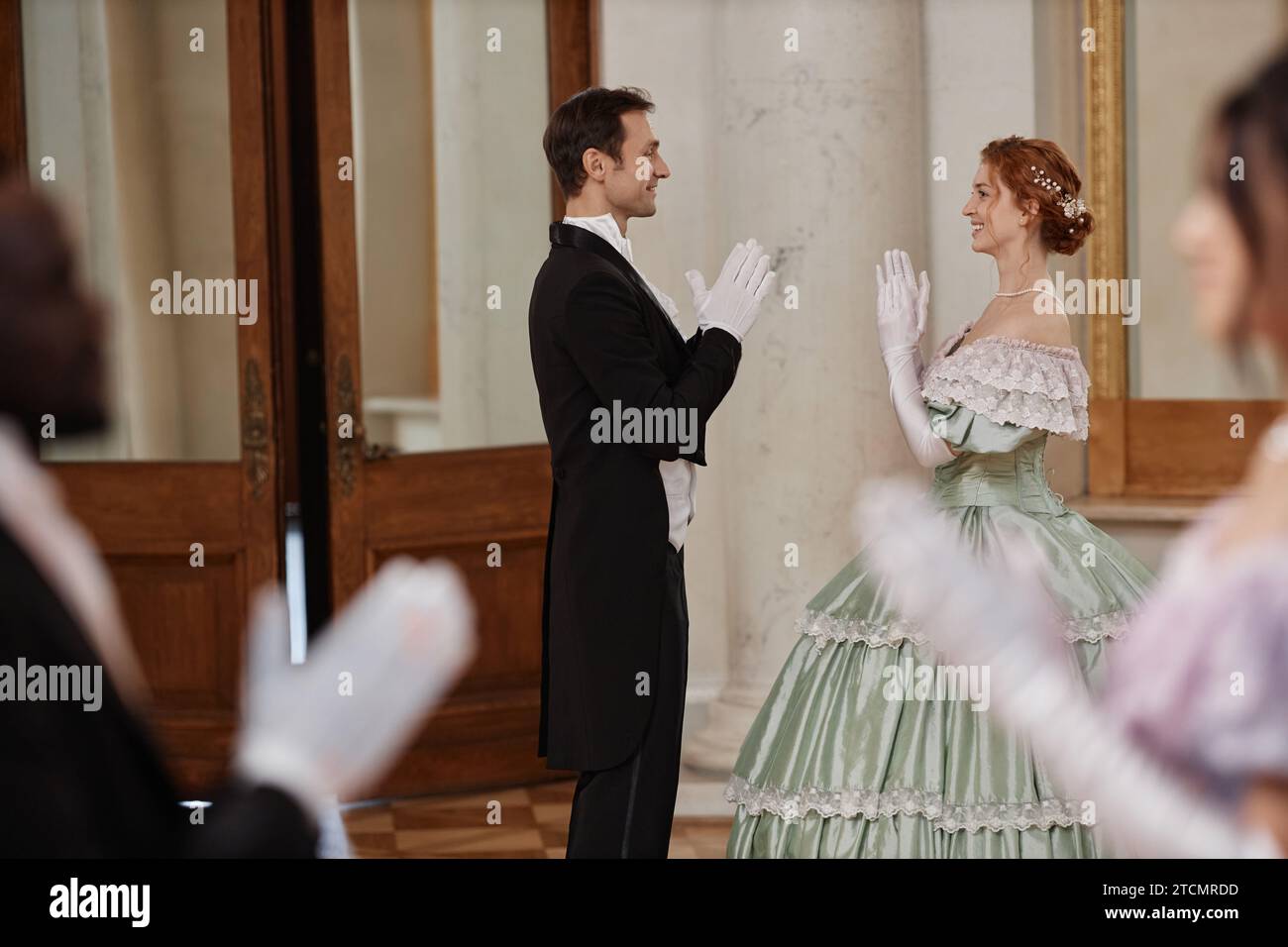 Side view portrait of young lady and gentleman enjoying frilly dance in ...