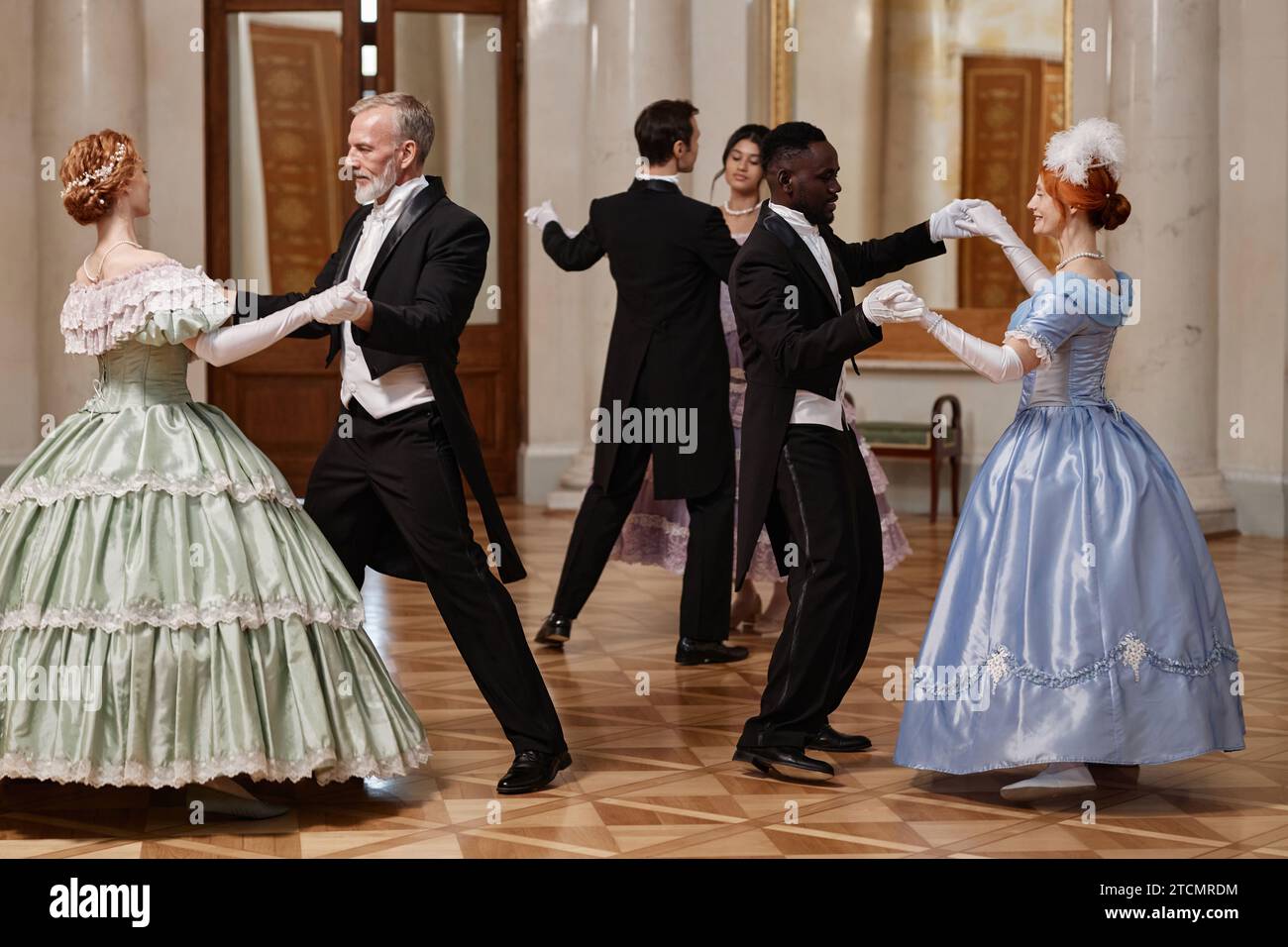 Full length portrait of three couples dancing waltz in classic palace ...