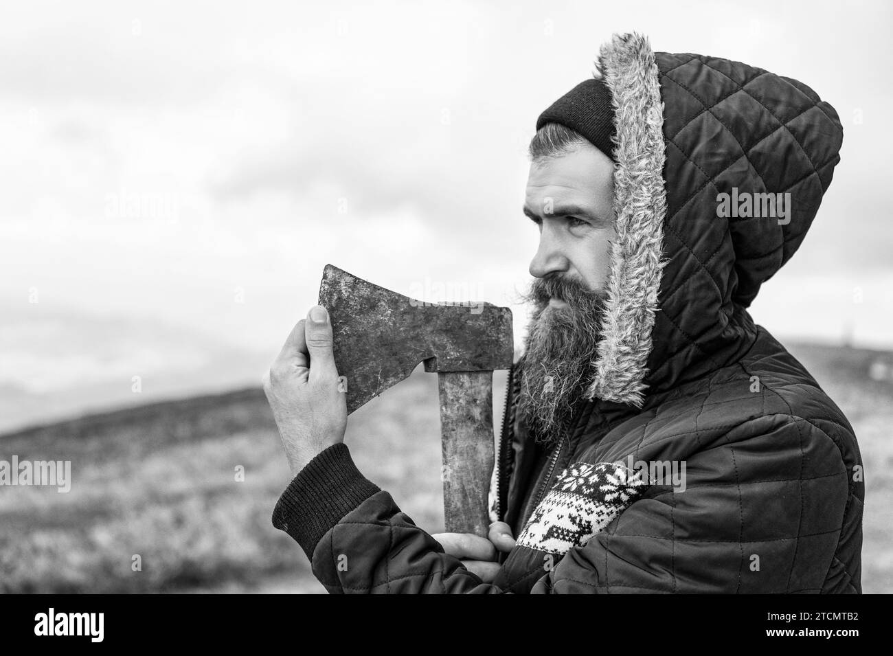 bearded man lumberjack with sharp axe. photo of bearded man lumberjack ...