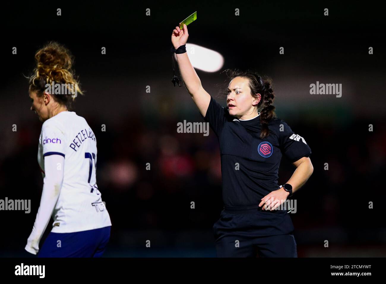 London, UK. 13th Dec, 2023. Referee Emily Heaslip awards a yellow card ...