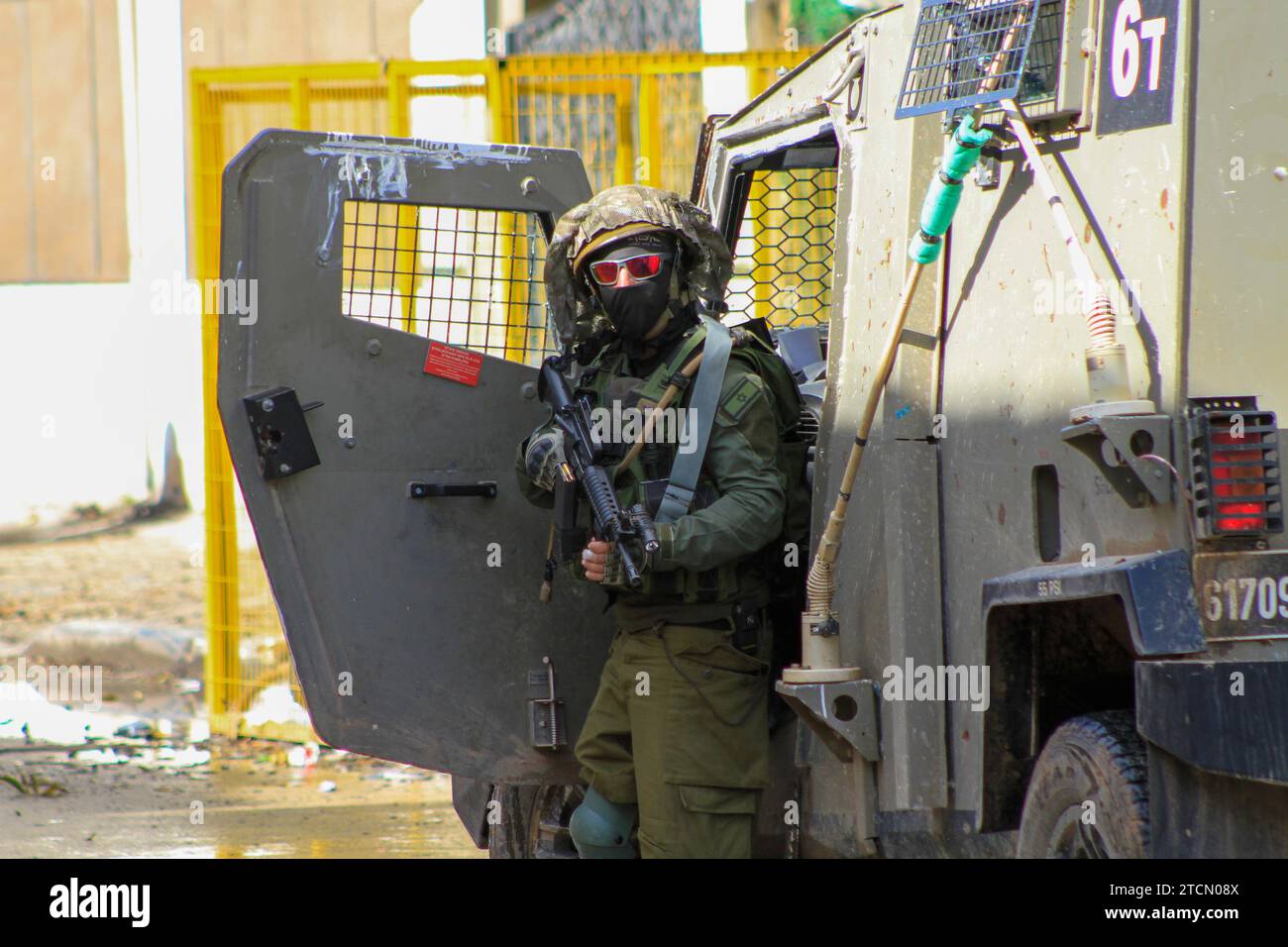 Jenin, Palestine. 13th Dec, 2023. An Israeli soldier takes his position ...