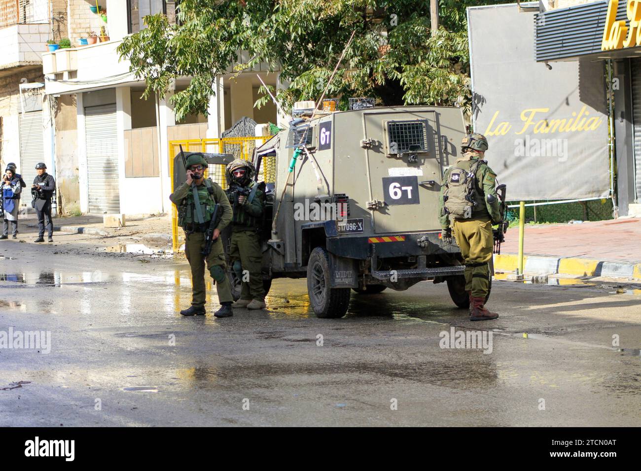 Jenin, Palestine. 13th Dec, 2023. Israeli soldiers take their positions ...