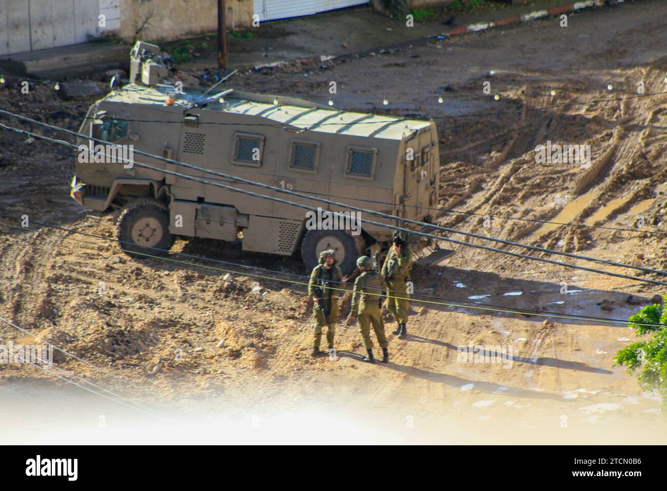Jenin, Palestine. 13th Dec, 2023. Israeli soldiers take their positions ...