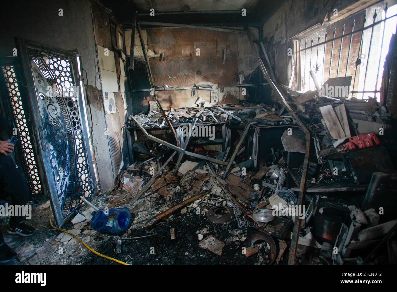 Jenin, Palestine. 13th Dec, 2023. Palestinian inspects the damage ...