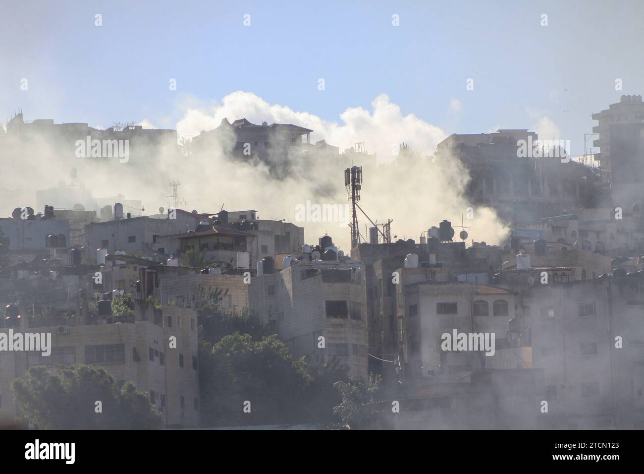 Jenin, Palestine. 13th Dec, 2023. Smoke rises from a Palestinian house ...