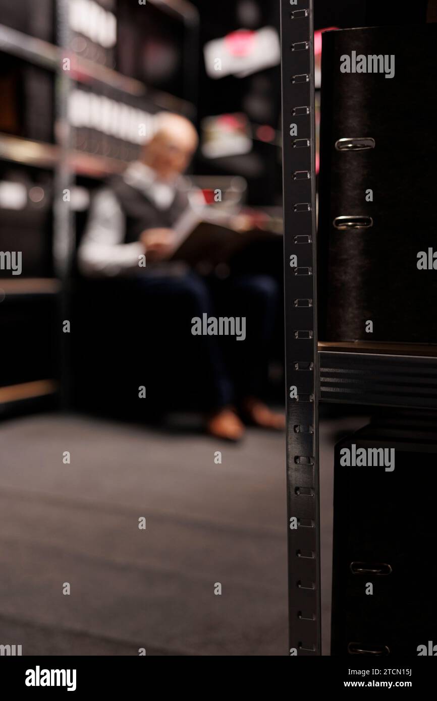 Selectiv Focus Of Metallic Storage Full With Confidential Files In Background Elderly Private