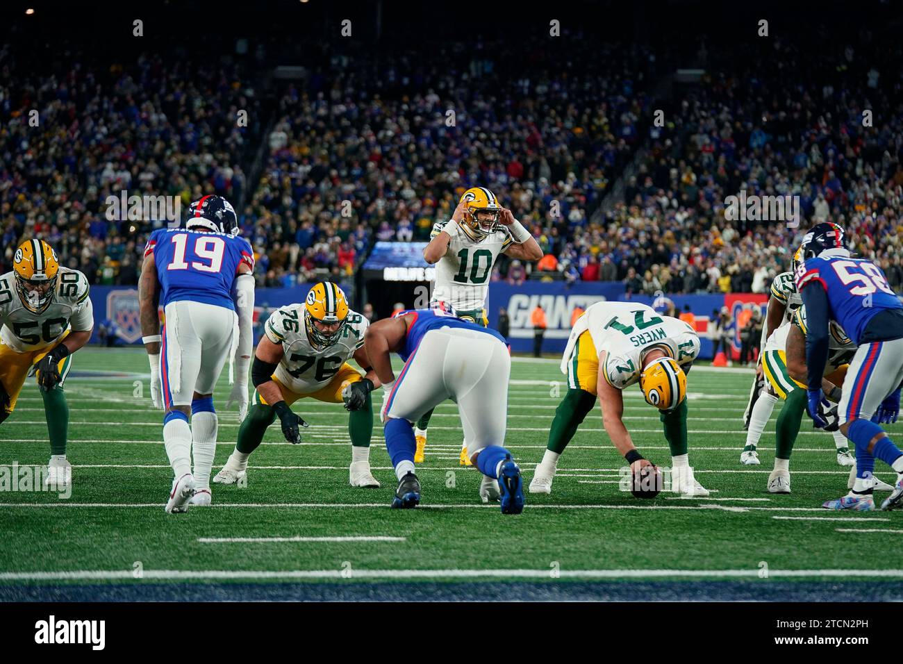 Players line up at the line of scrimmage during an NFL football game ...