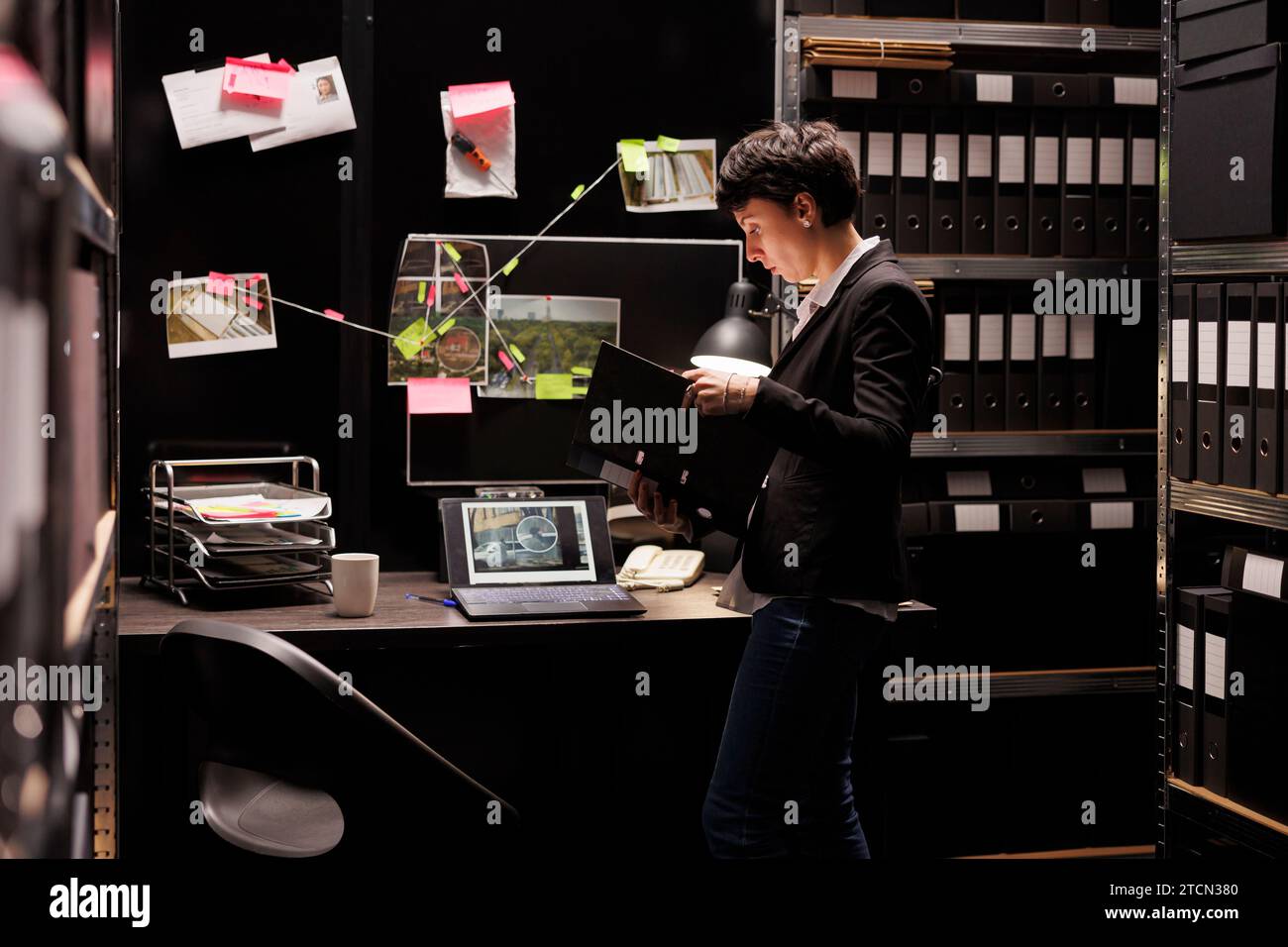 Police officer investigating fraude case analyzing confidential report ...