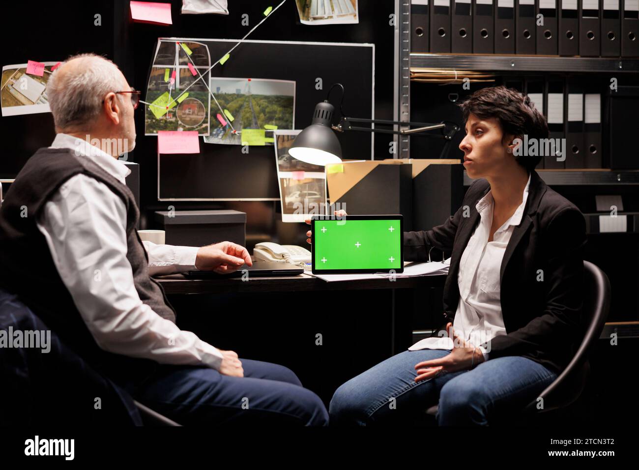 Private investigators working overtime at criminal case in arhive room ...