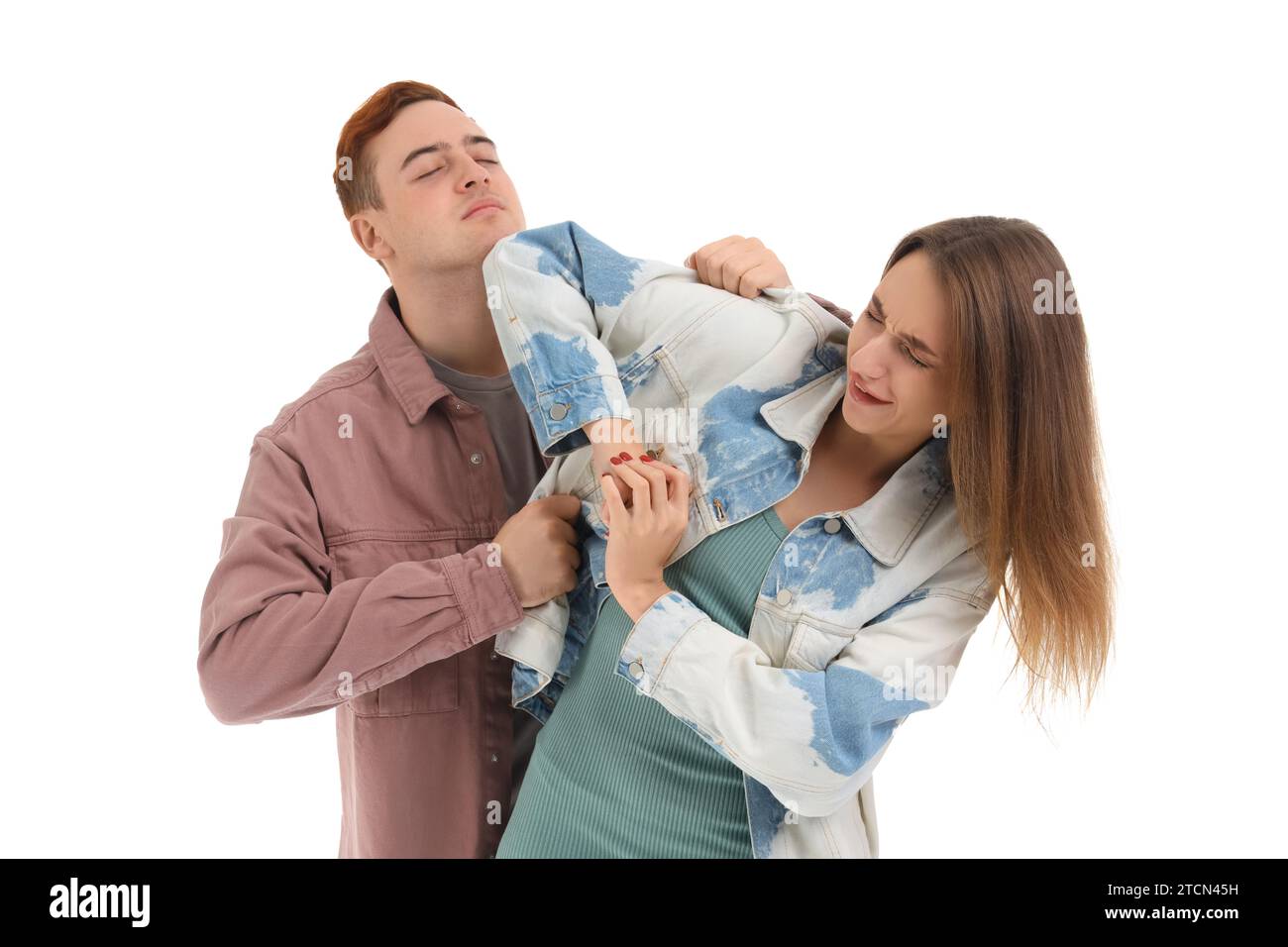 Young woman defending herself on white background Stock Photo - Alamy