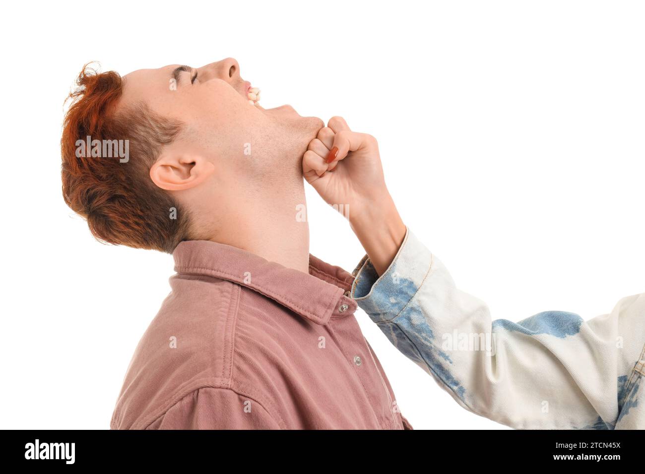 Young woman defending herself on white background Stock Photo - Alamy