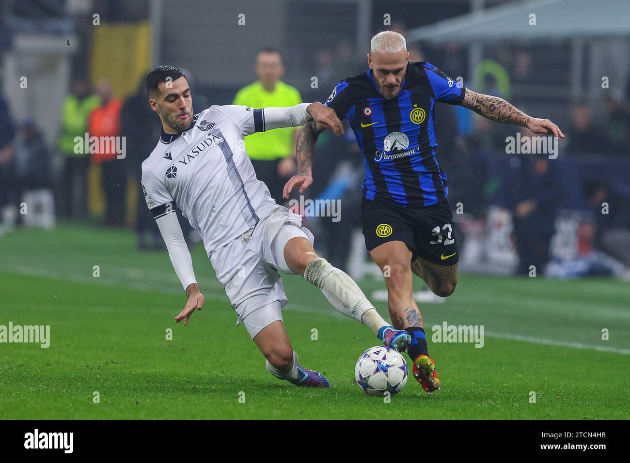 Federico Dimarco of FC Internazionale (R) and Mikel Merino of Real Sociedad de Futbol (L) in ...