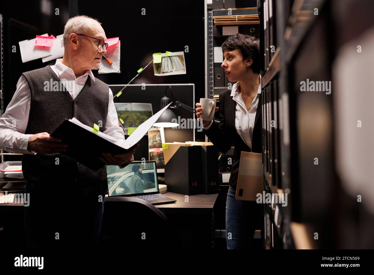 Police officer working at criminal case with investigator, analyzing ...