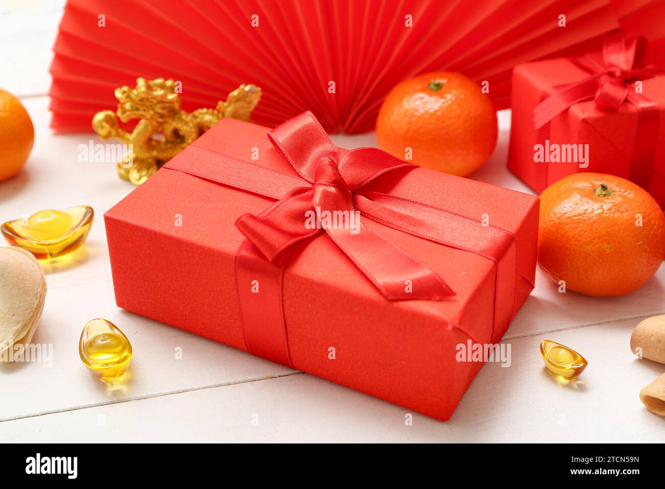Gift box with fortune cookies, mandarins and Chinese symbols on white ...