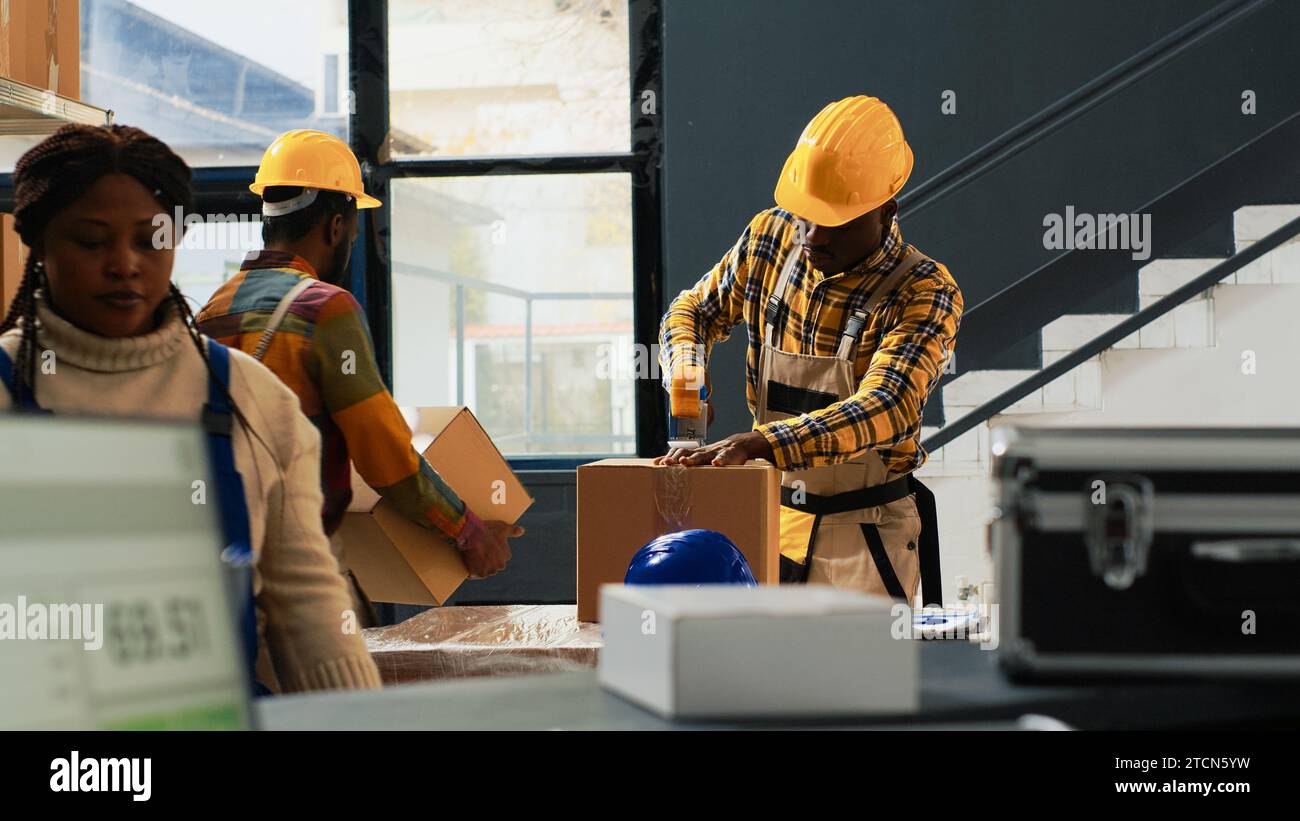 Depot workers team packing boxes hi-res stock photography and images ...