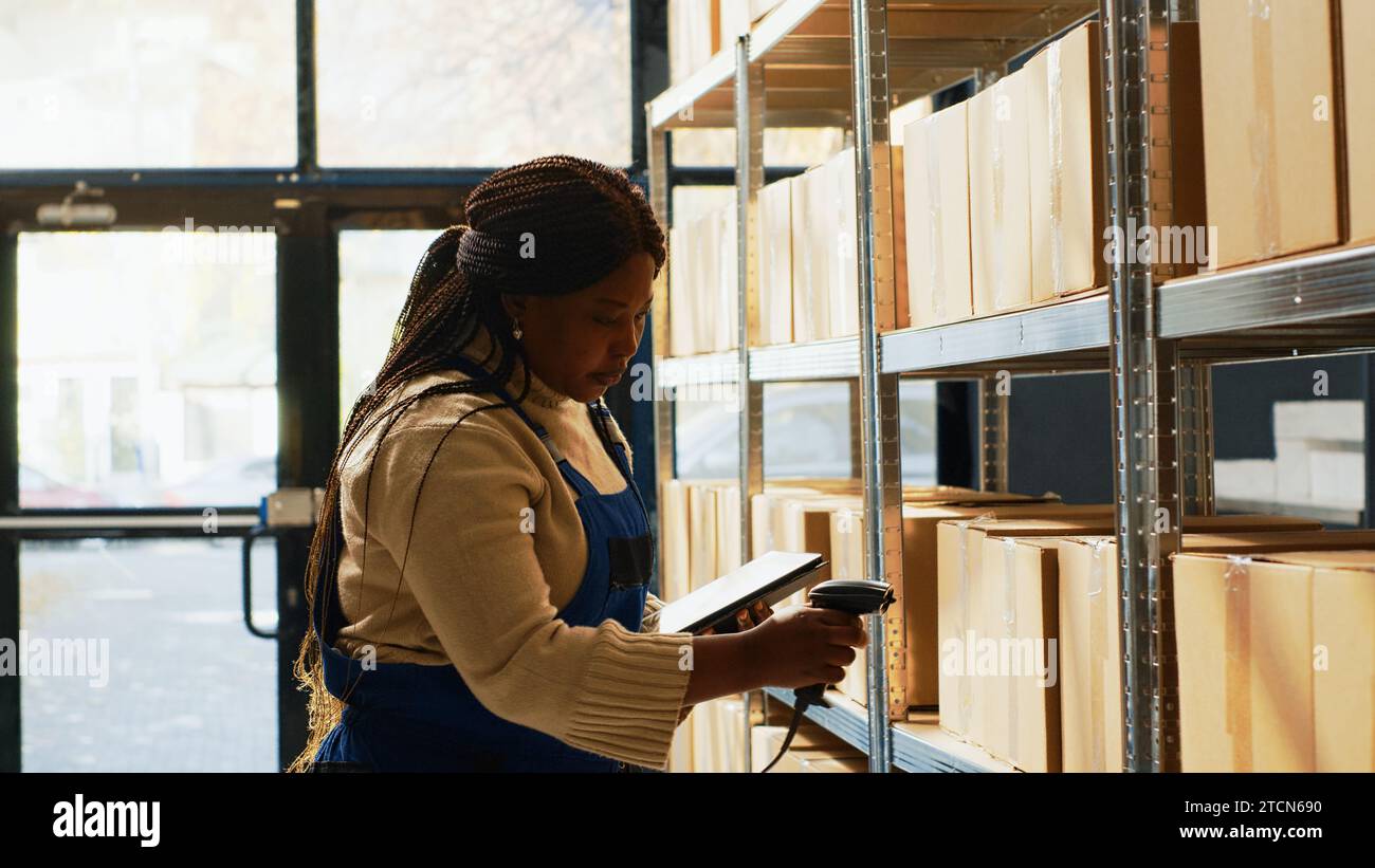 African american person working with scanner and tablet, scanning ...