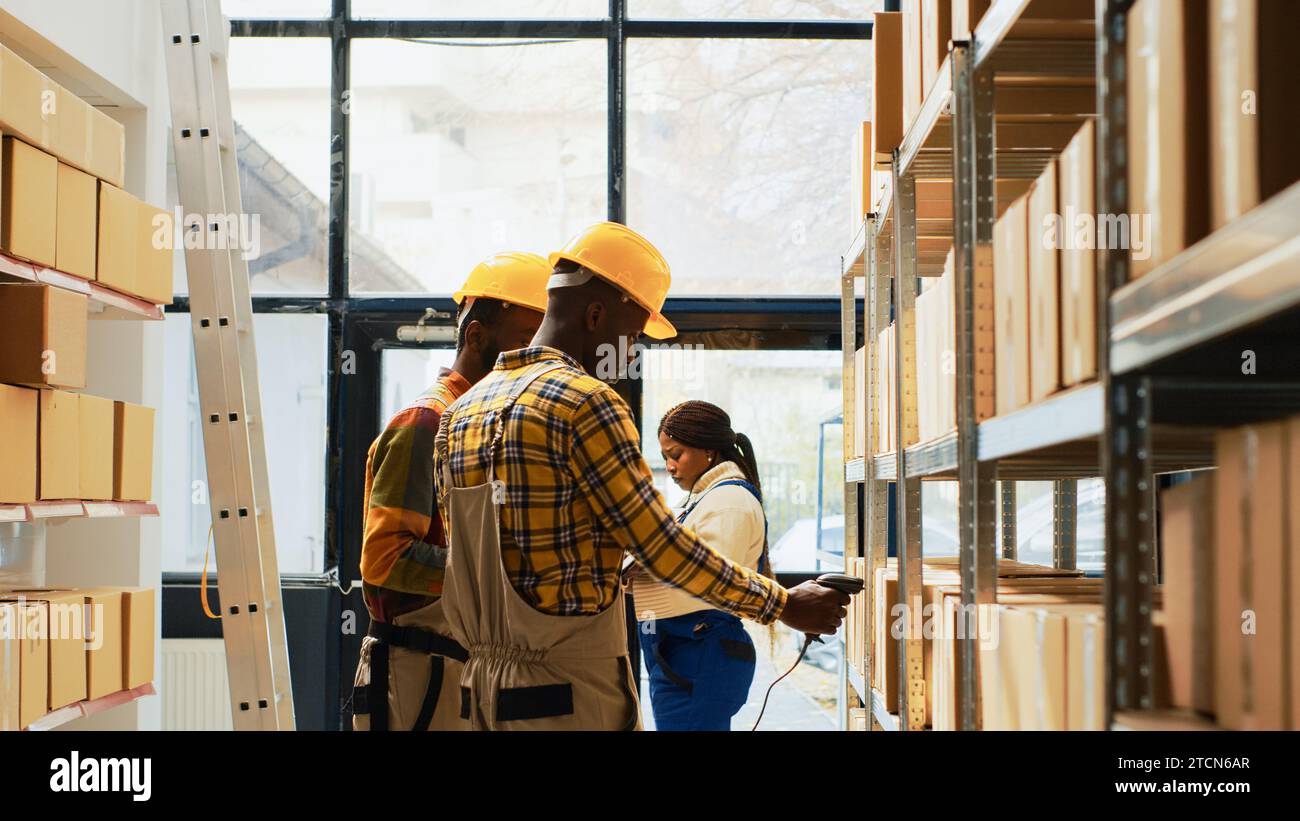 African american men working on supplies logistics with scanner and ...