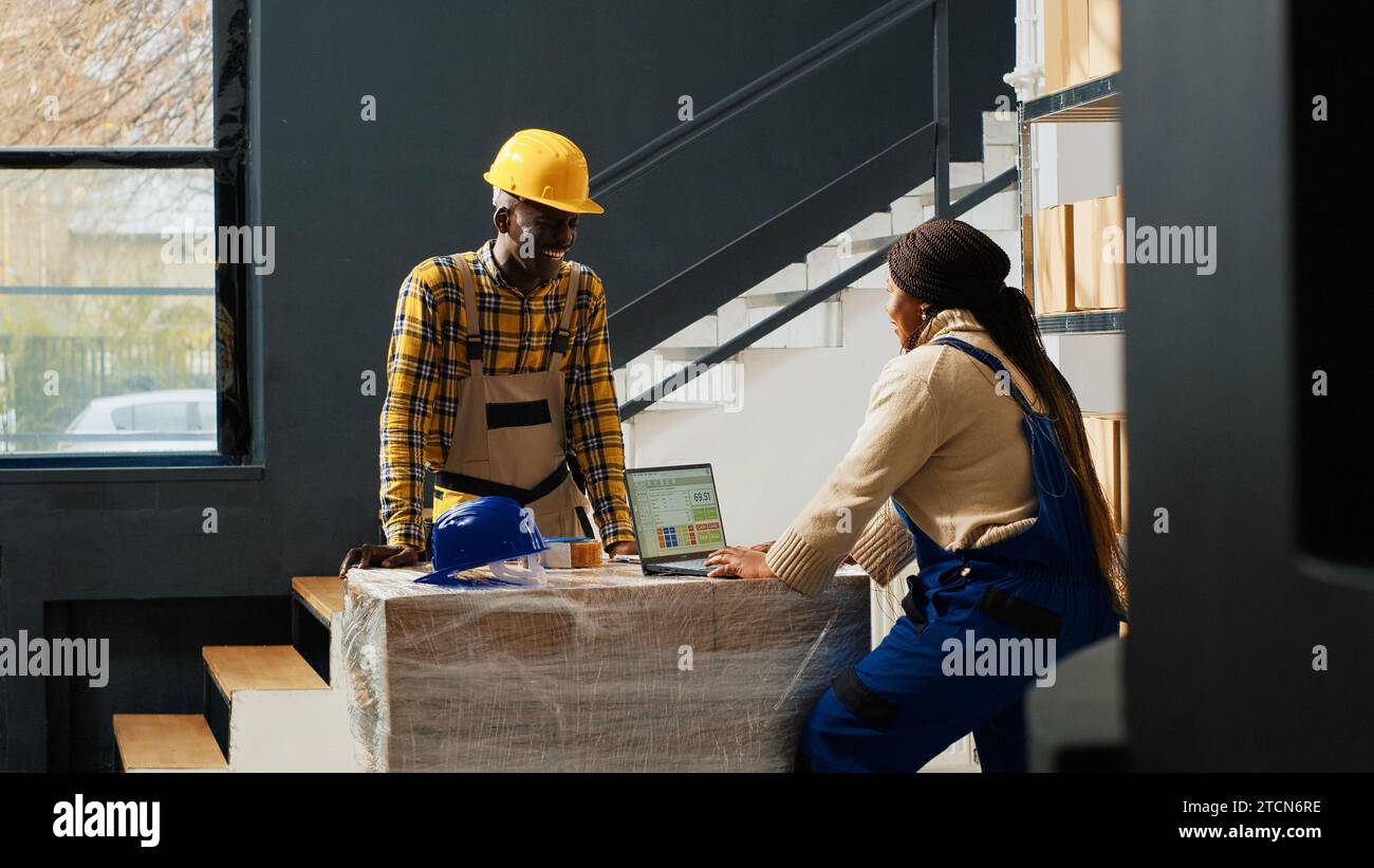 Warehouse employee laughing at work hi-res stock photography and images ...