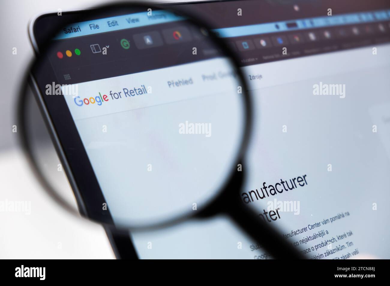 Google for Retail logo on the screen of laptop through magnifying glass ...