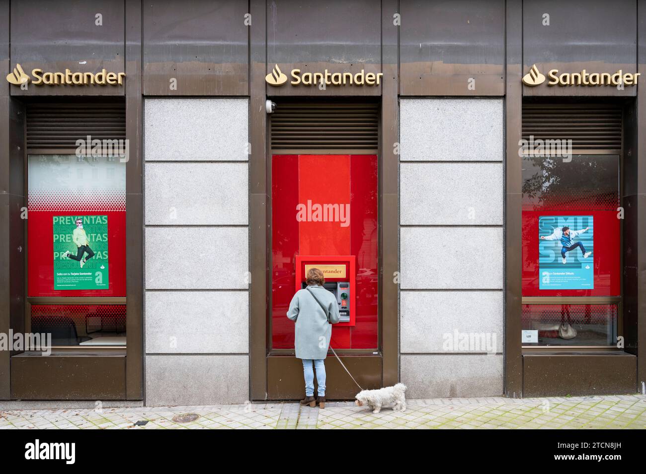 Madrid, Spain. 13th Dec, 2023. A customer uses the ATM machine from the ...
