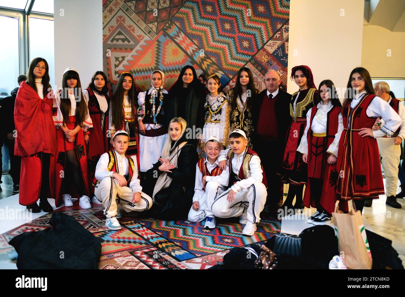 Tirana, Albania - November 28: A group of Albanian citizens, including students and teachers ...