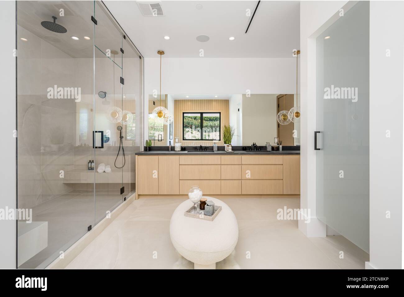 This modern bathroom features a spacious and luxurious walk-in shower ...