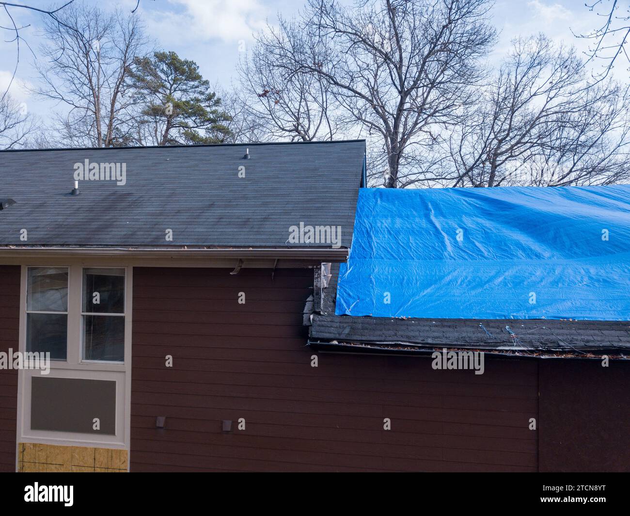 drone images of a fire damaged apartment building with a large tarp ...