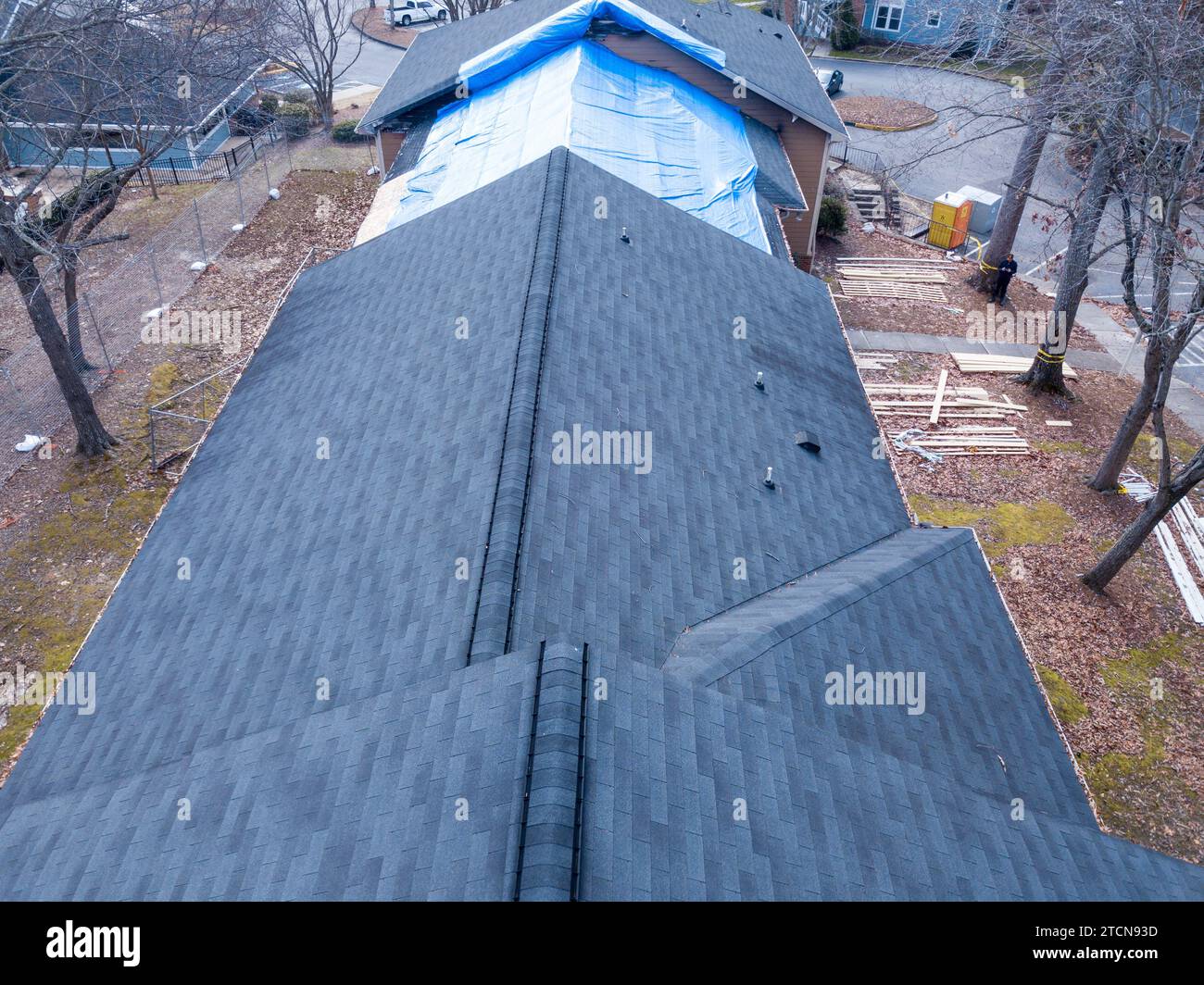 drone images of a fire damaged apartment building with a large tarp ...