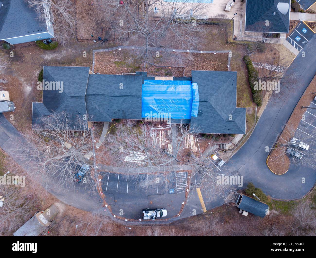 drone images of a fire damaged apartment building with a large tarp ...