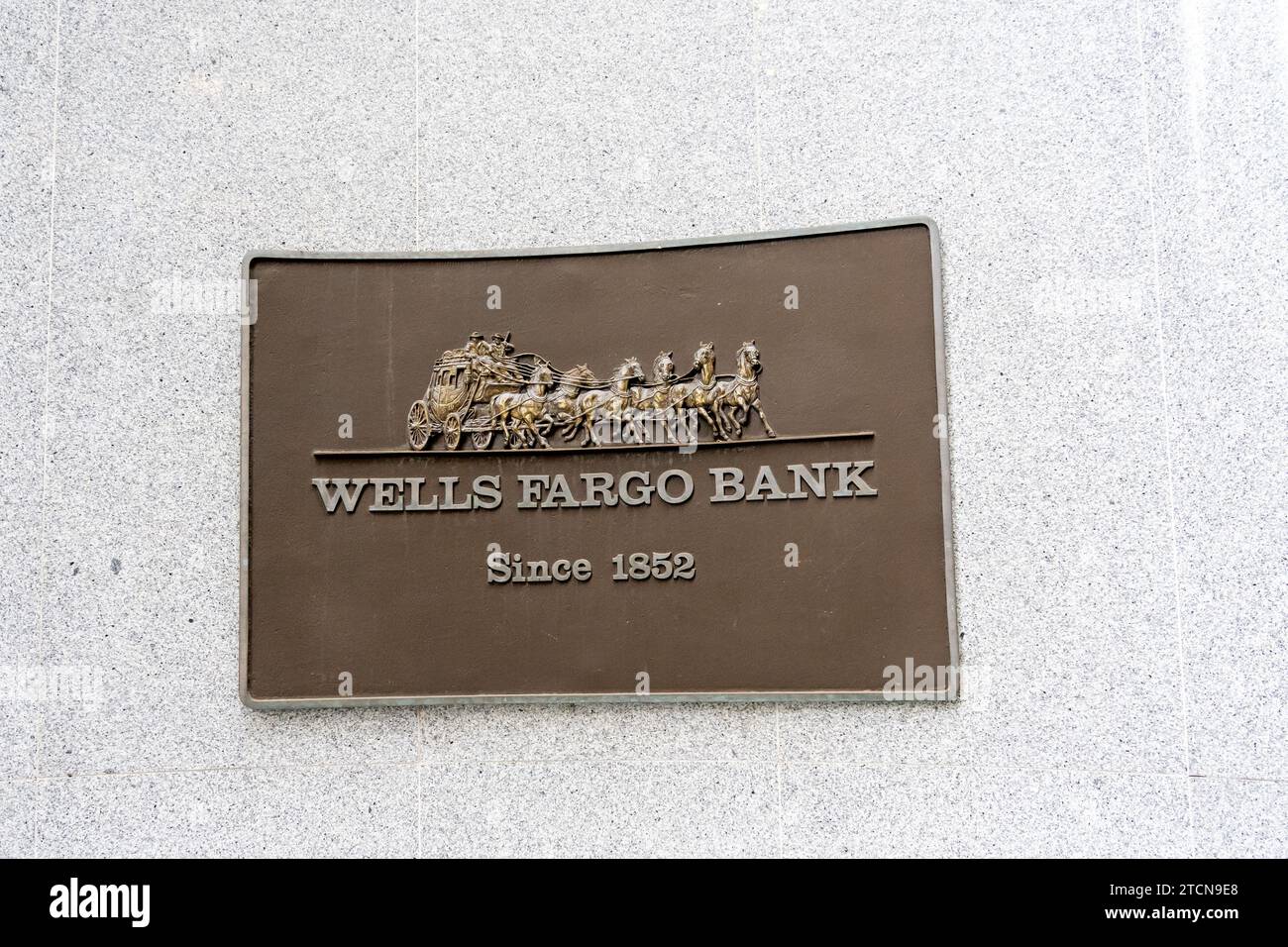 The Wells Fargo Bank stagecoach metal sign on the building at Wells ...