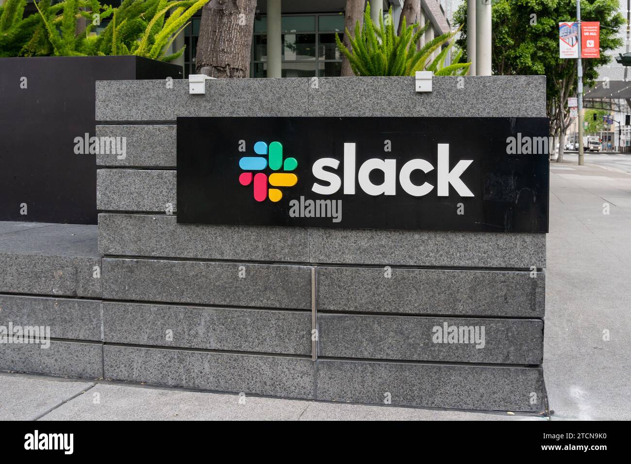 Slack logo and sign at its headquarters in San Francisco, California ...