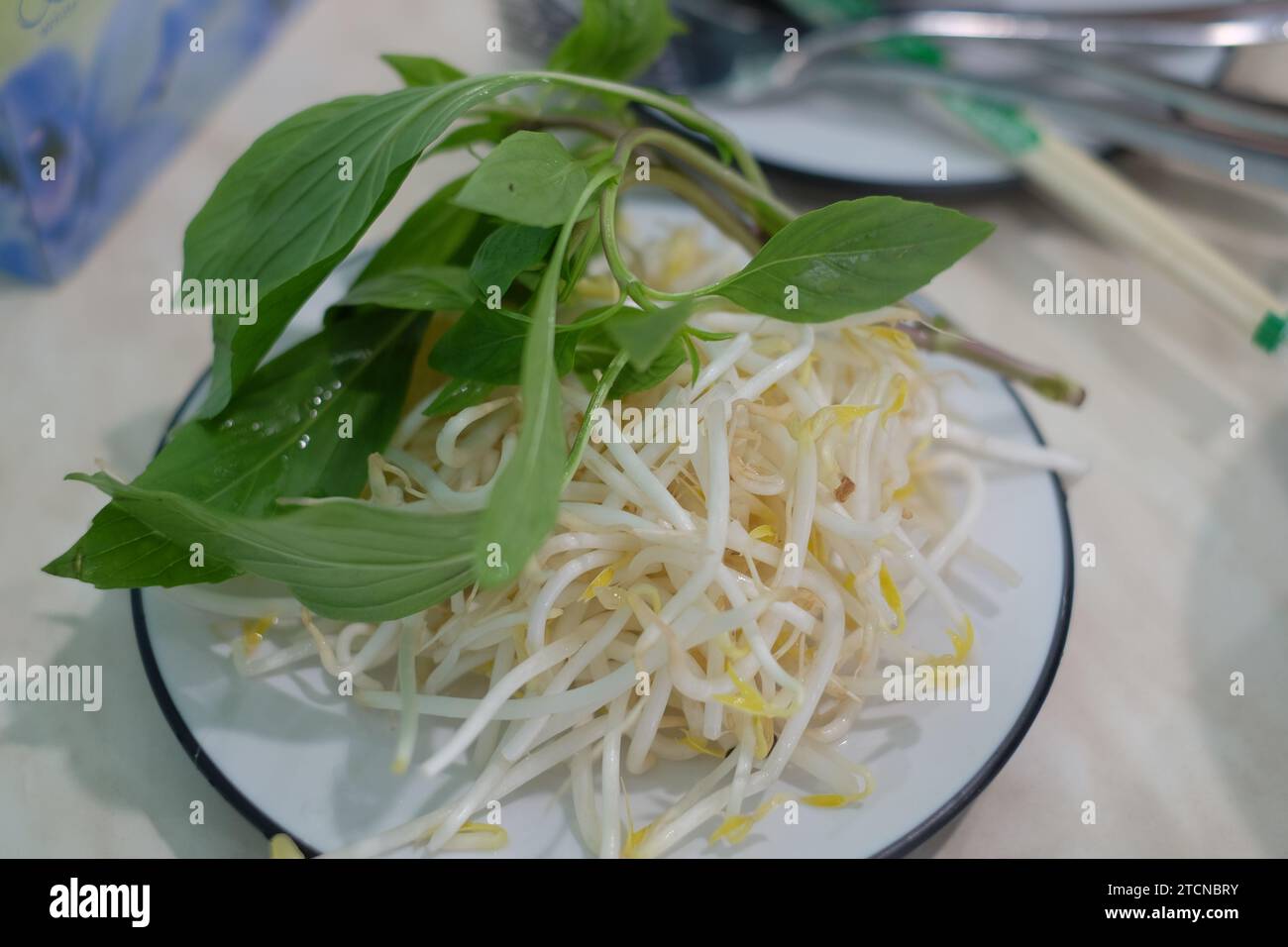 Bean shoots and basil, Pho Vietnamese rare beef noodle soup ...