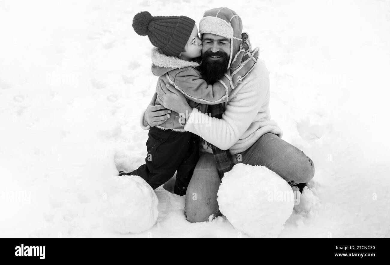Daddy and son smiling and hugging. Best winter game for happy family ...