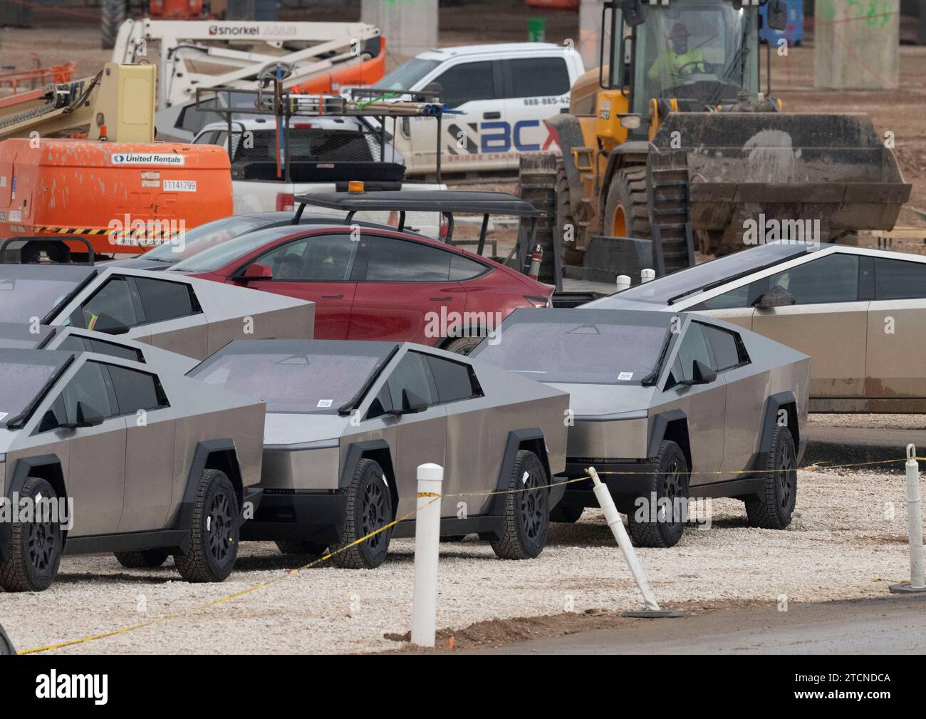 New Tesla Cybertrucks are parked outside the huge Tesla factory in ...