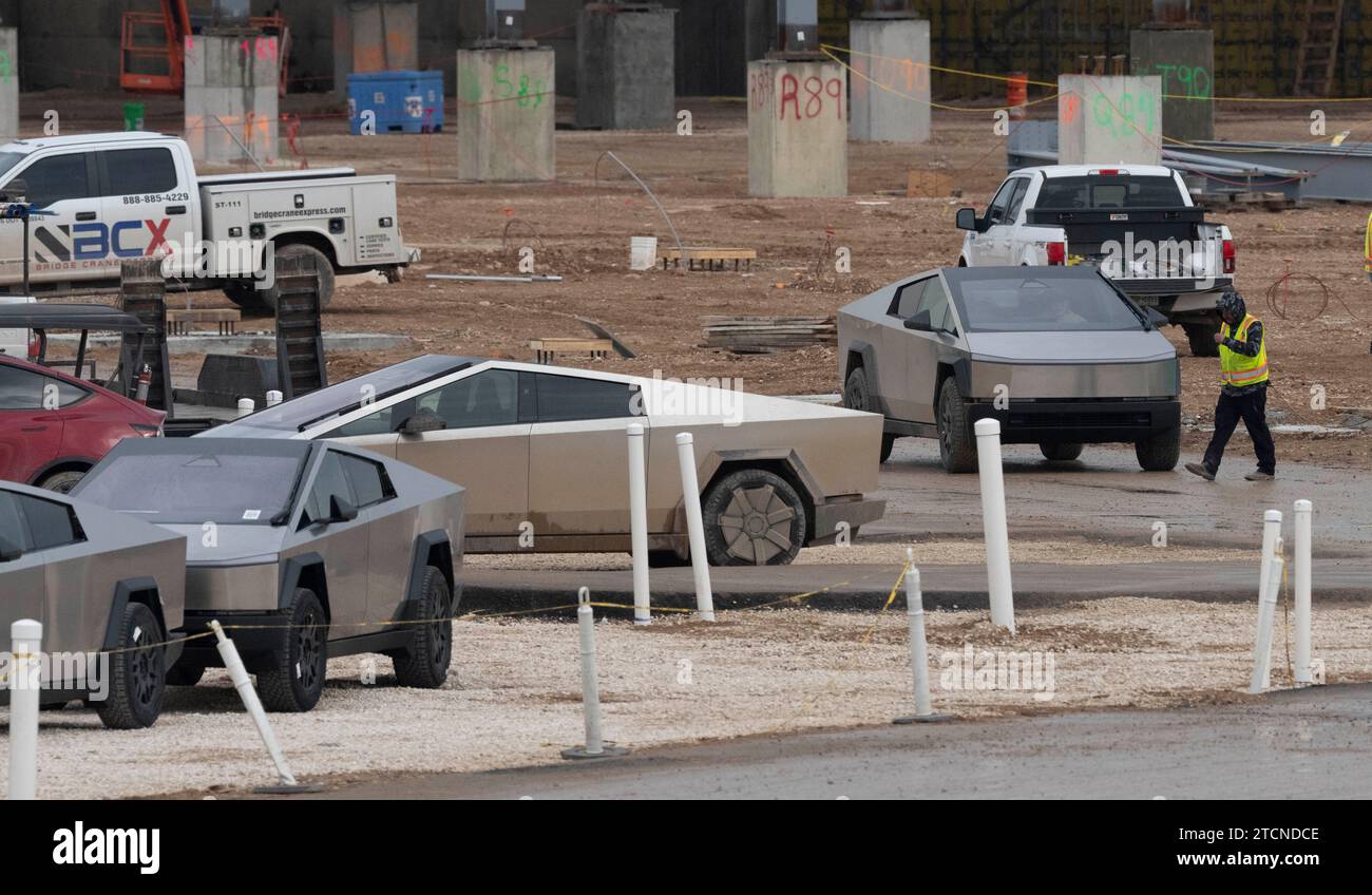 New Tesla Cybertrucks are parked outside the huge Tesla factory in ...