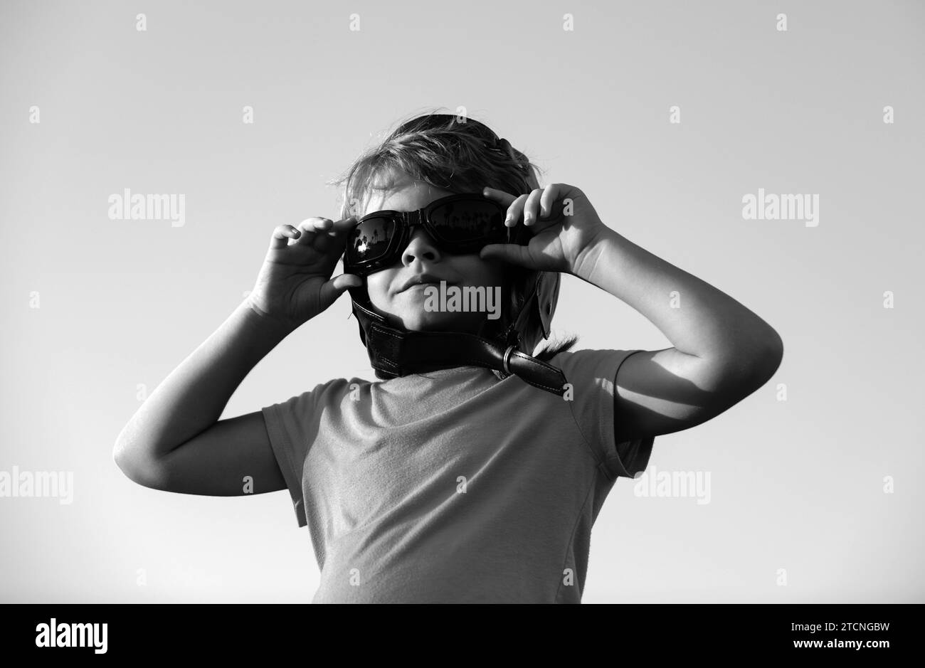 Little boy with pilot goggles and helmet, boy wants to become pilot and ...