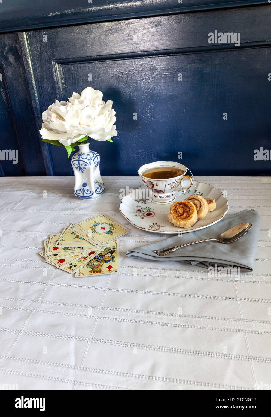 The perfect bridge card hand with a cup of tea and cookies Stock Photo ...