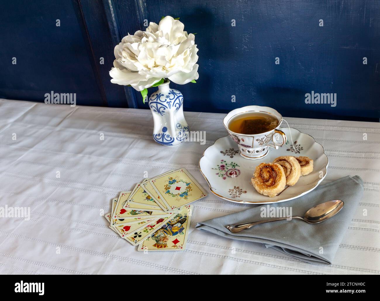 The perfect bridge card hand with a cup of tea and cookies Stock Photo ...