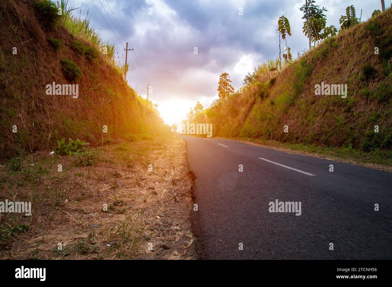 Winding asphalt road between two hi-res stock photography and images - Alamy