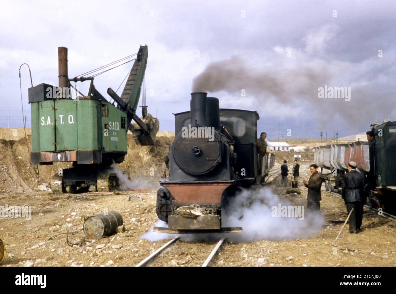 MADRID, SPAIN - 1954: General view of steam locomotive with a backhoe ...