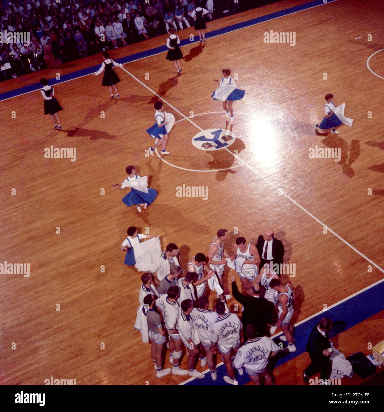 PROVO, UT - JANUARY 12: The BYU Cougars huddle as cheerleaders perform ...