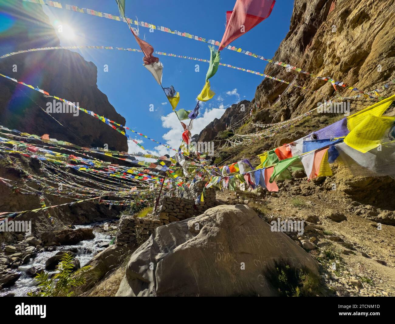 Prayer flags at Chungsi Cave also known as Rangchung Cave, a Buddhist ...