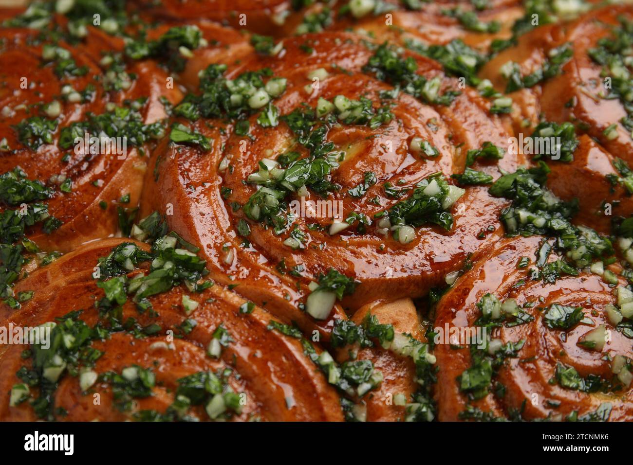 Traditional Ukrainian garlic bread with herbs (Pampushky), closeup view ...