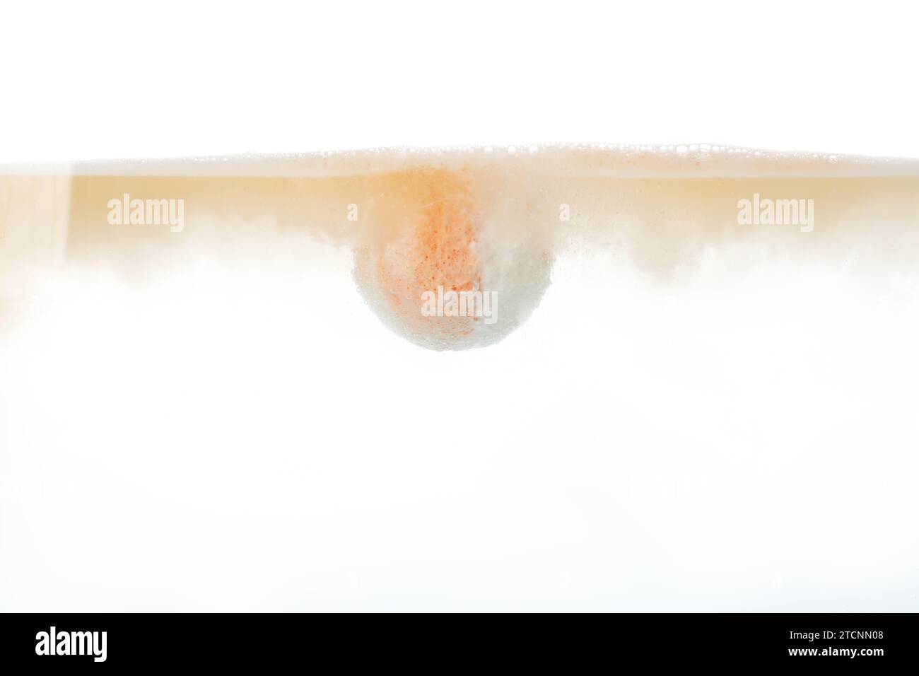 Bath bomb in water on white background Stock Photo - Alamy
