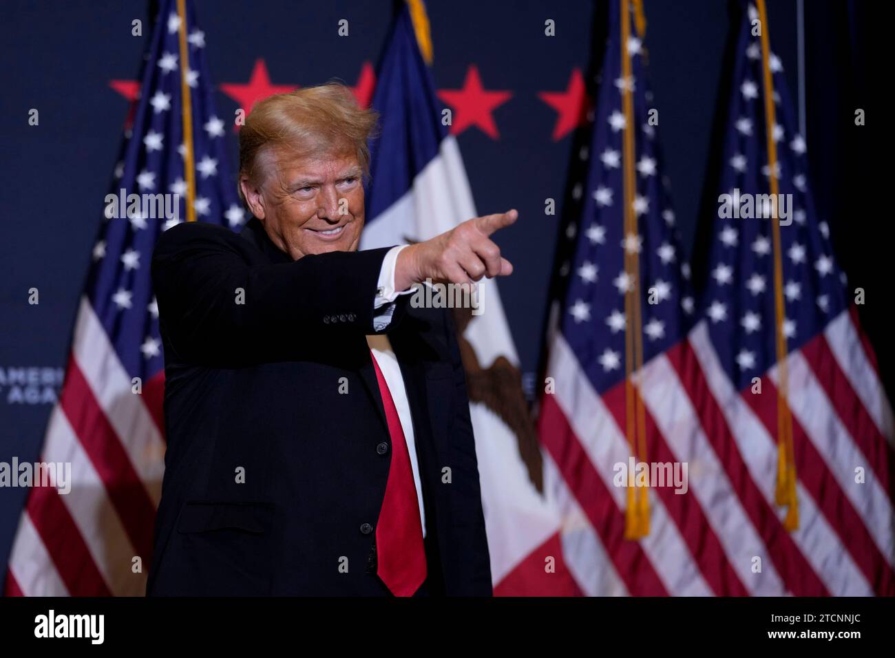 Former President Donald Trump arrives at a commit to caucus rally ...